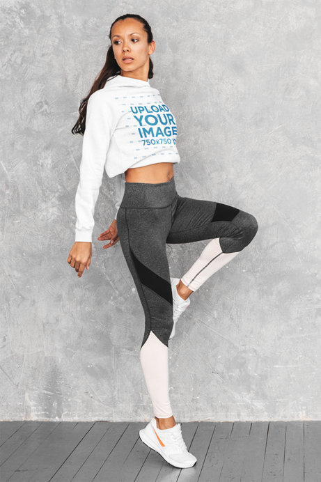 Placeit - Crop Top Hoodie Mockup of a Fit Woman Doing Short Jumps