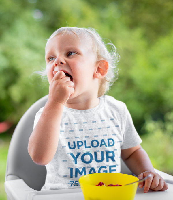 Placeit - Heathered Tee Mockup Featuring a Baby Eating