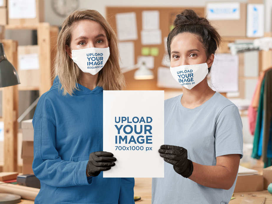 Placeit - Mockup of Two Women Holding a Poster While Wearing Face Masks