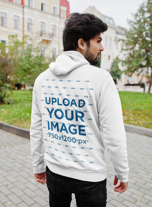 Placeit - Back View Hoodie Mockup Featuring a Man Walking in the Street