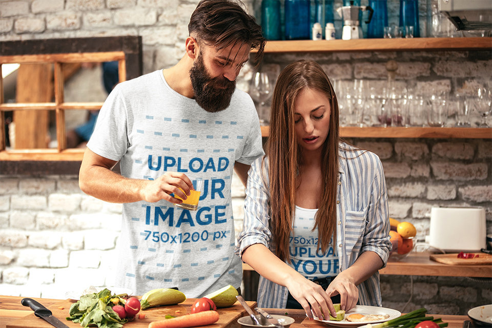 Placeit - Heather T-Shirt and Tank Top Mockup of a Couple Cooking Together