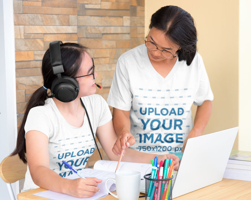 Placeit - T-Shirt Mockup of a Teacher and Her Student Taking a Class