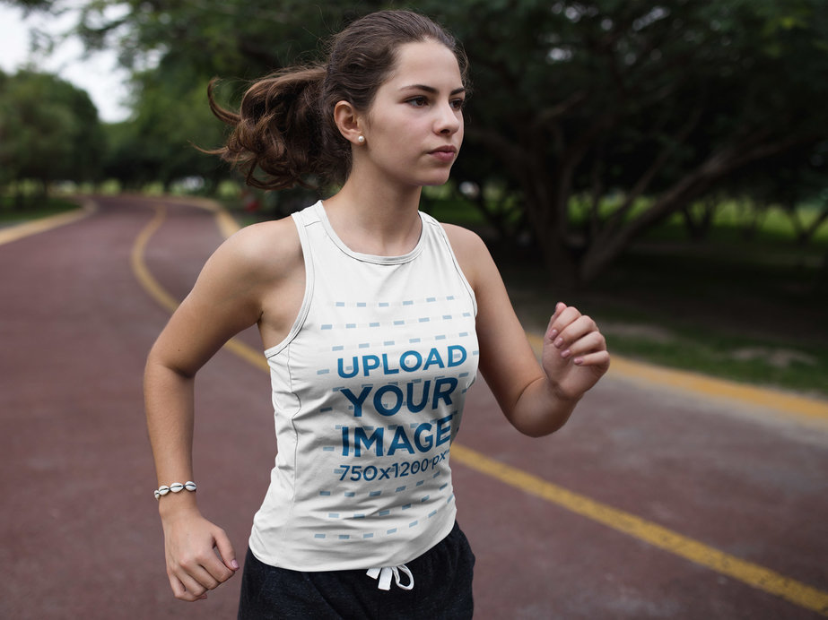 Placeit - Sleeveless Shirt Mockup of a Woman Running at a Running Track ...