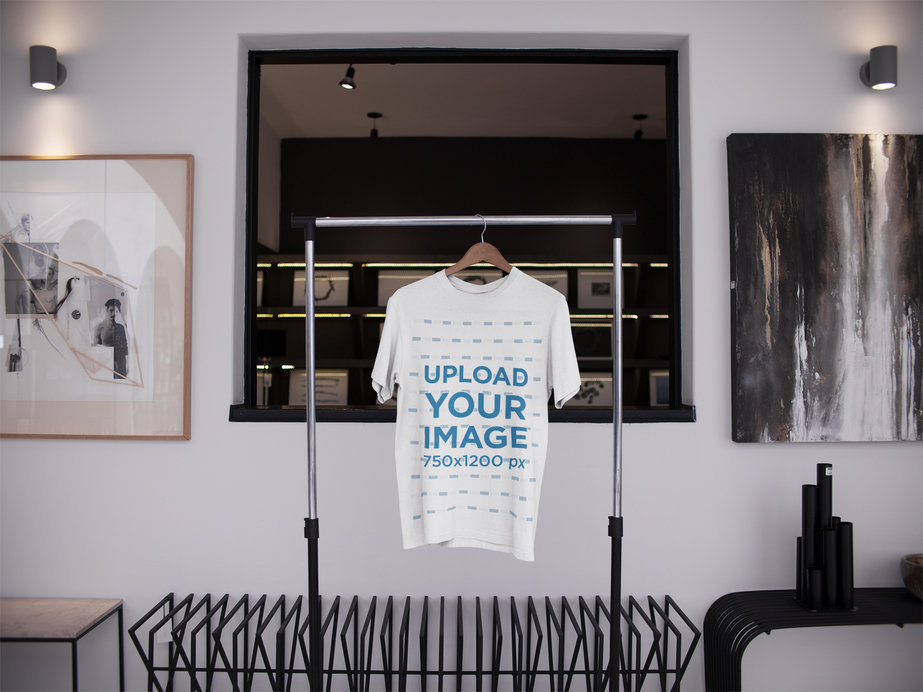 Placeit - T-Shirt on a Rack Mockup While Inside an Artists Room