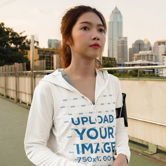 Placeit - Full Zip Hoodie Mockup of a Serious Woman on a Morning Run