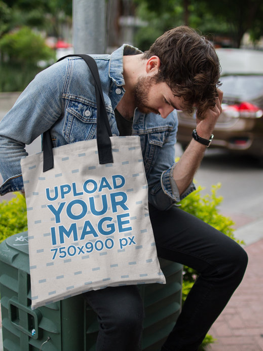 Placeit - Man Carrying a Tote Bag Mockup While Looking to the Floor in ...