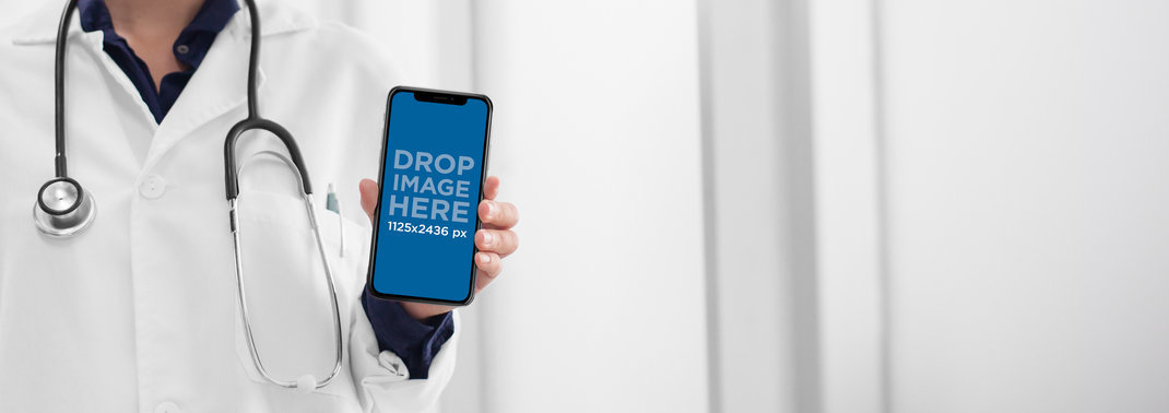 Placeit - Doctor Holding an iPhone 11 Pro Mockup While at the Hospital