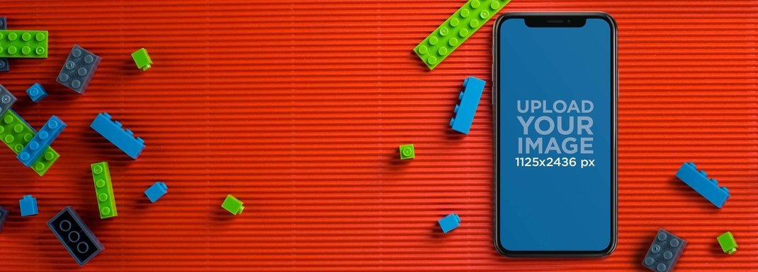 Placeit - Mockup of an iPhone 11 Pro Lying on a Desk with Legos
