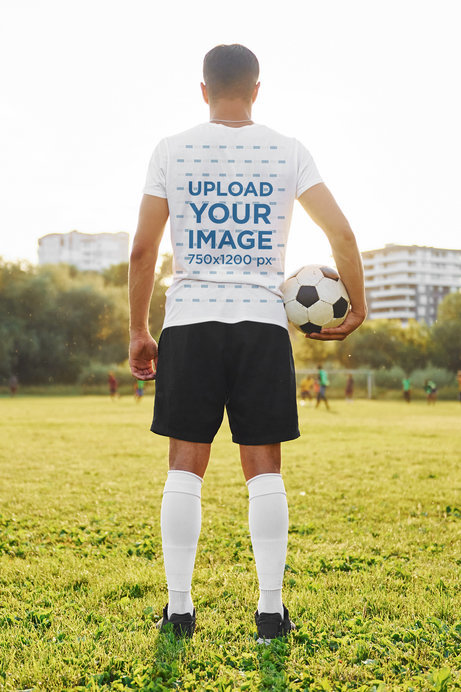 Placeit - Back-View Tee Mockup of a Soccer Player at a Field
