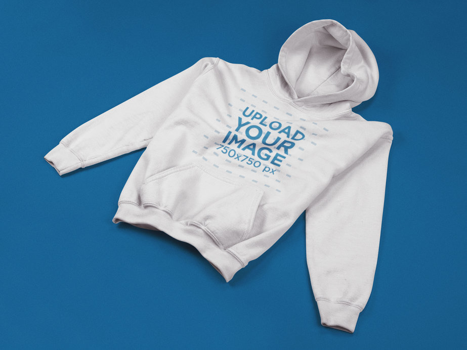 Placeit - Pulllover Hoodie Template Lying on a Flat Surface