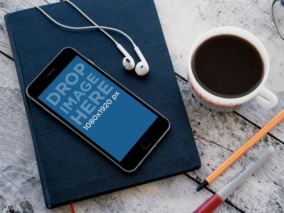 Placeit - Mockup of an iPhone on a Book