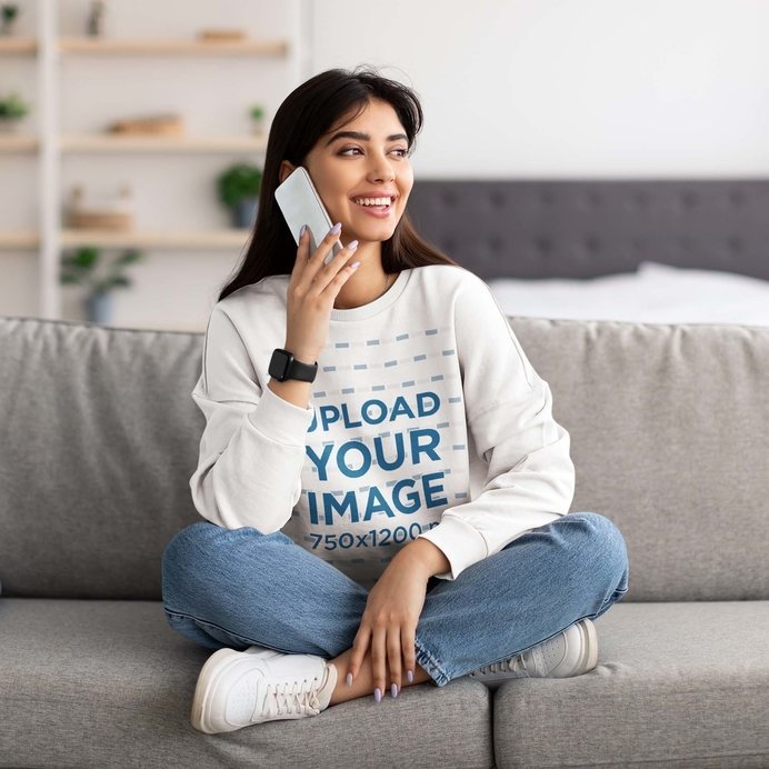 Placeit - Sweatshirt Mockup of a Happy Woman Sitting on a Couch and ...