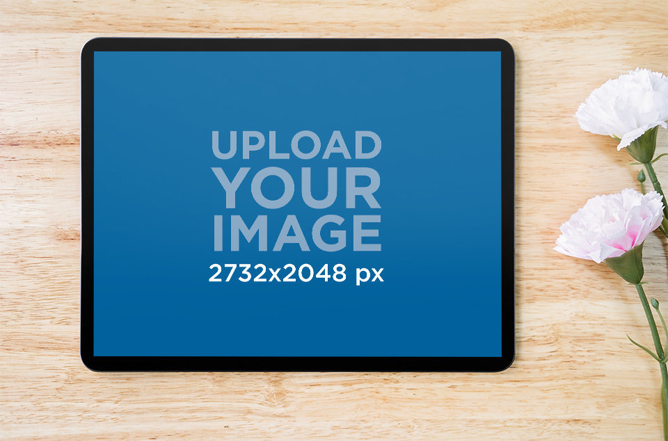 Placeit - Digital Mockup of an iPad Laid in Landscape Position over a ...