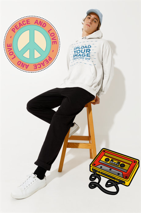 Placeit - Hoodie Mockup Featuring a Man Sitting on a Stool and Cool ...