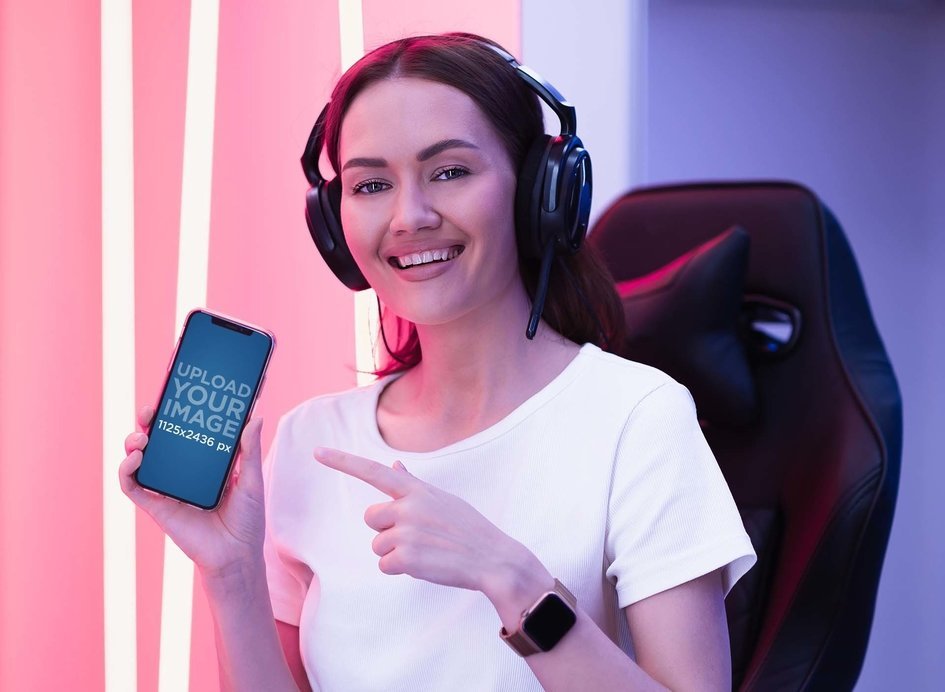 Placeit - Mockup Featuring a Female Gamer Pointing at Her iPhone