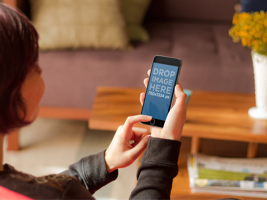 Placeit - iPhone 6 Mockup in Lounge / Living Room