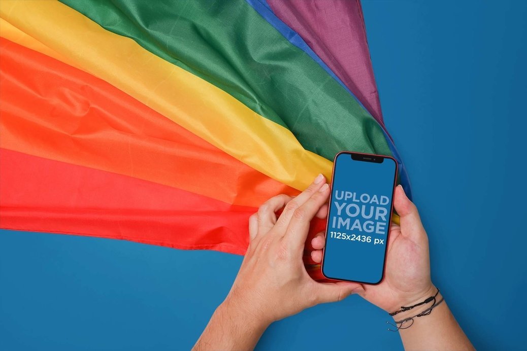 Placeit - Mockup of an iPhone 12 Pro Featuring an LGBT Pride Flag