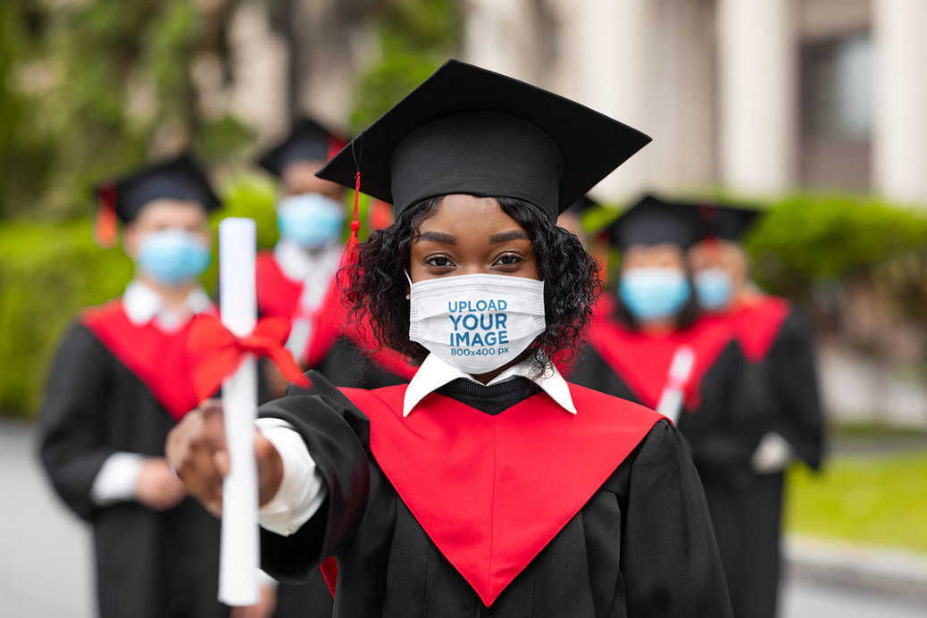 Placeit - Face Mask Mockup Featuring a Woman With a Graduation Diploma