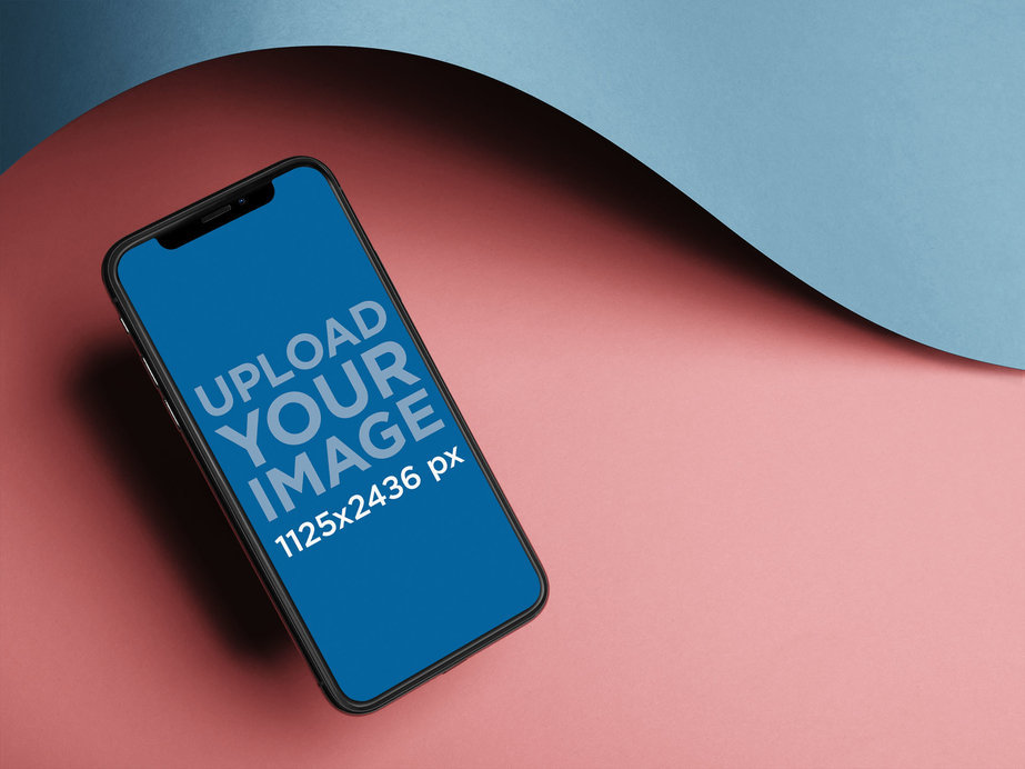 Placeit - iPhone 11 Pro Mockup Floating Angled Near a Curved Paper