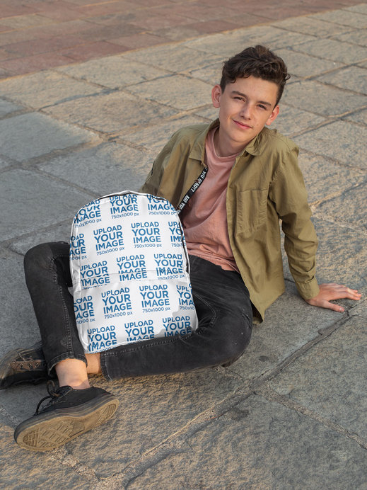 Placeit - Backpack Mockup Featuring a Happy Teenage Boy Sitting on the ...
