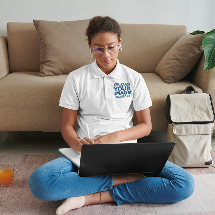 Placeit - Polo Shirt Mockup of a Young Woman Working on Her School Homework