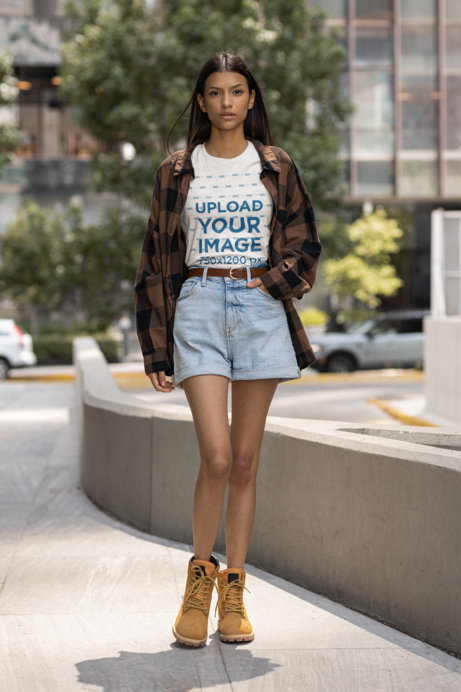 Placeit - Round-Neck Tee Mockup Featuring a Woman Walking in the Street