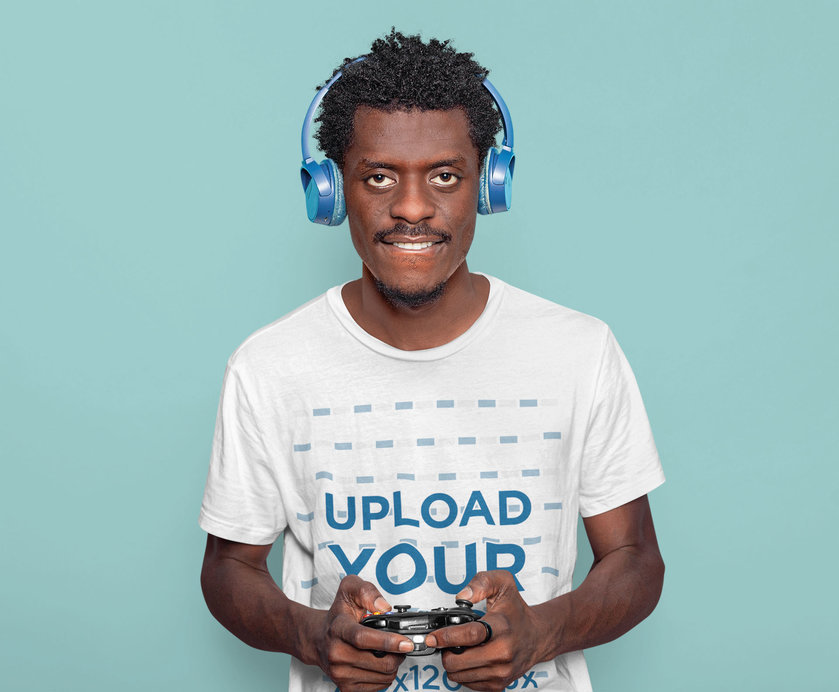 Placeit - T-Shirt Mockup of a Man with an Afro Hairstyle Playing with a ...