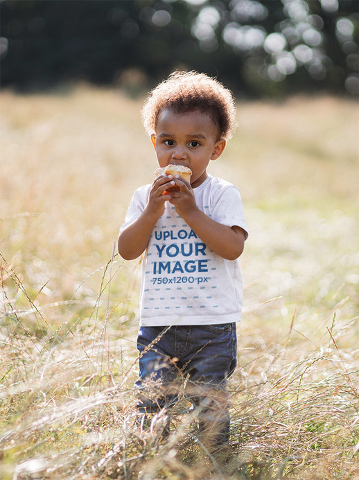 Placeit - Round-Neck Tee Mockup Featuring a Cute Boy Eating a Cupcake