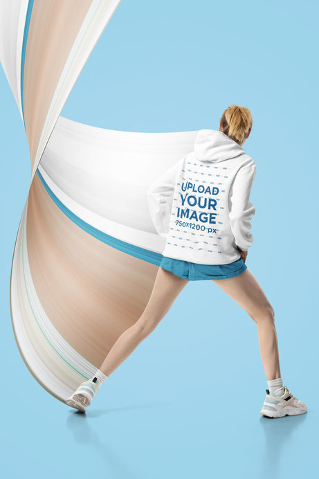 Placeit - Back-View Mockup of a Woman Making a Quick Movement in a Studio