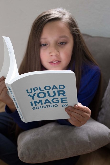 Placeit - Mockup of a Book Being Read by a Girl