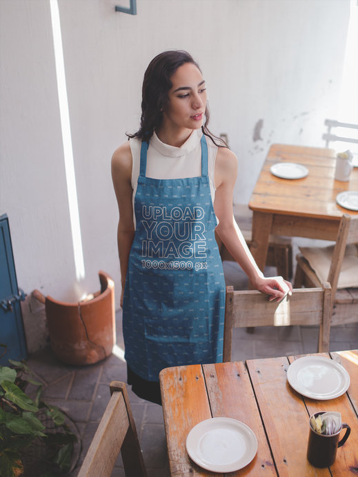 Placeit - Apron Mockup Featuring a Woman in a Restaurant