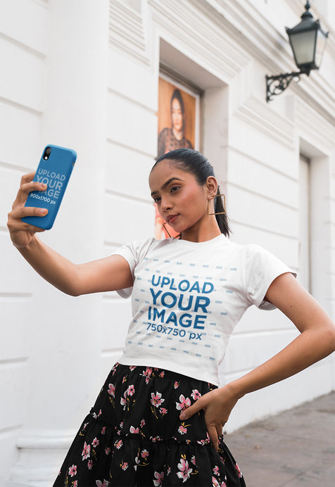 Placeit - Crop Top and Phone Case Mockup Featuring a Woman Taking a Selfie