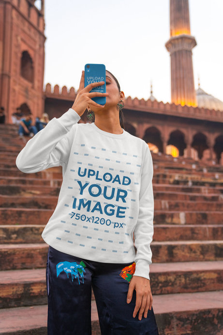 Placeit - Phone Case Mockup of a Woman in a Sweatshirt Taking a Picture ...