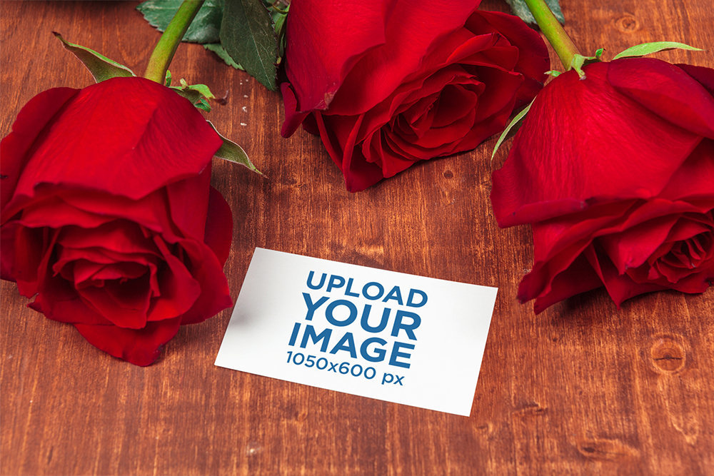 Placeit - Horizontal Flyer Mockup Featuring Red Roses over a Wooden Surface