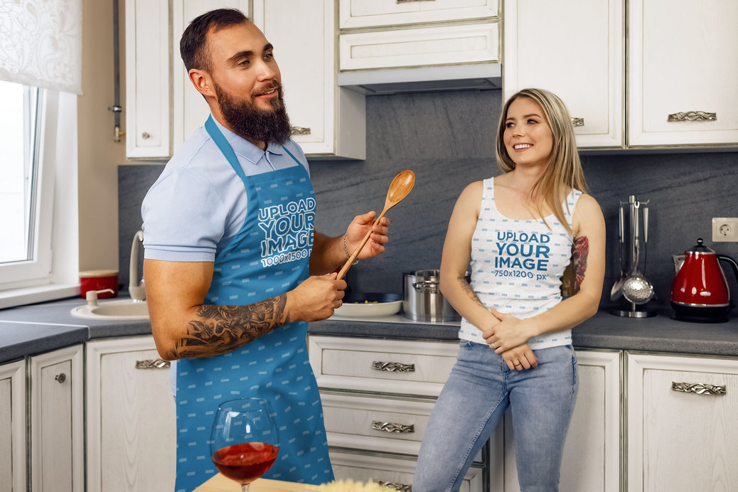 Placeit - Apron and Tank Top Mockup of a Happy Couple Cooking
