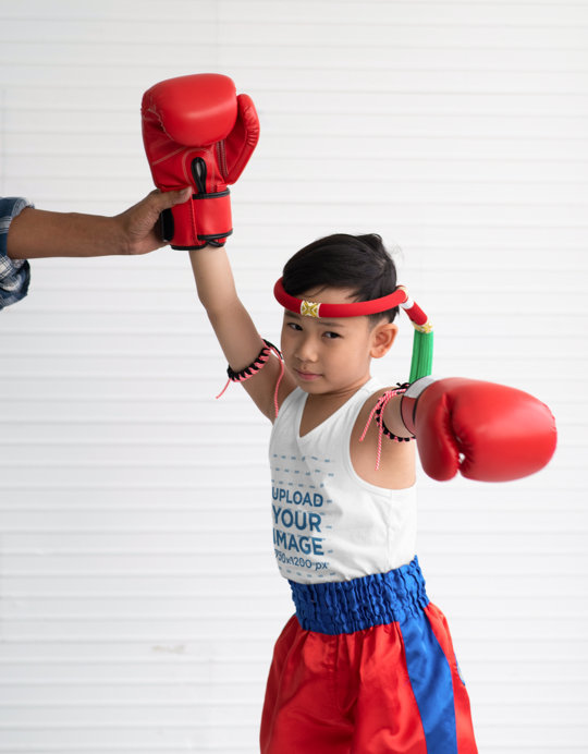 Placeit - Tank Top Mockup Featuring a Boy Training With Boxing Gloves
