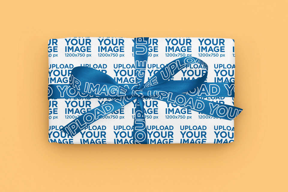 Placeit - Wrapping Paper Mockup Featuring a Gift With a Ribbon