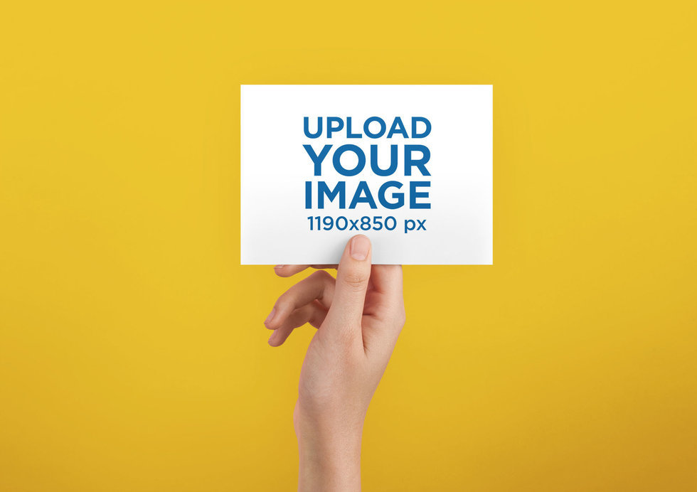 Placeit - Horizontal Post Card Template Being Held Against a Solid ...