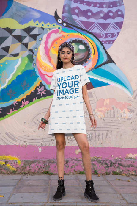 Placeit - T-Shirt Dress Mockup of a Young Woman Featuring a Mural Wall