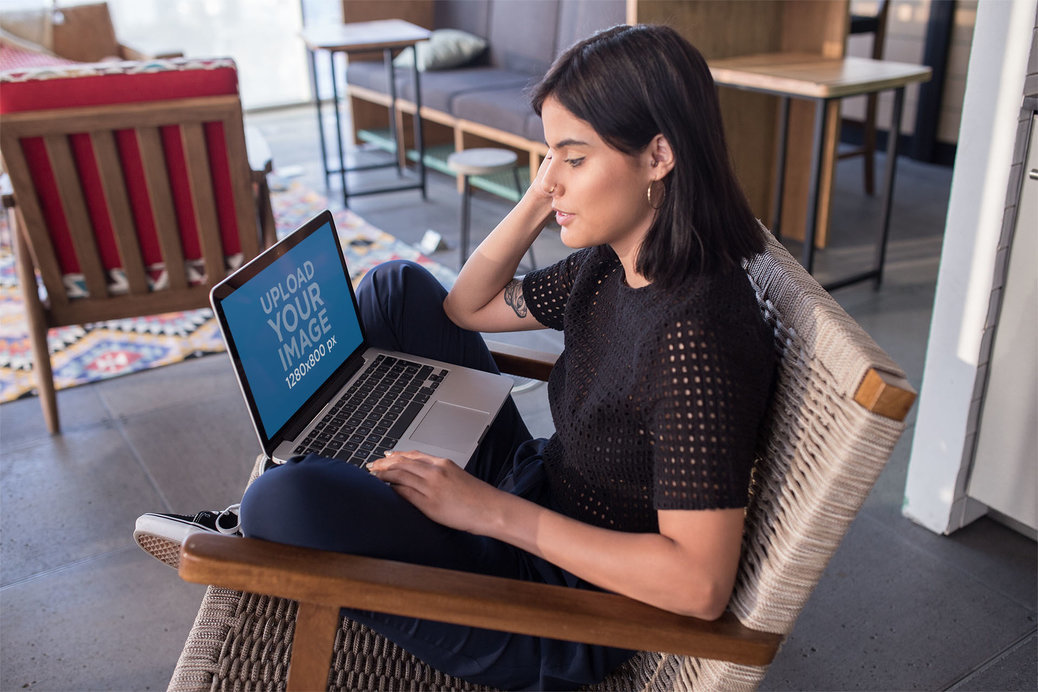 Placeit - Woman Working with a MacBook Pro Mockup Sitting Outside