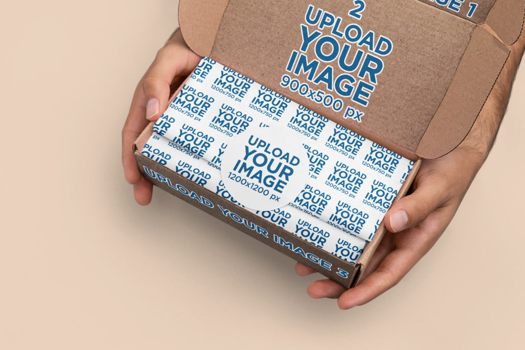 Placeit - Mockup of a Man Holding a Box With Wrapping Paper and a Sticker