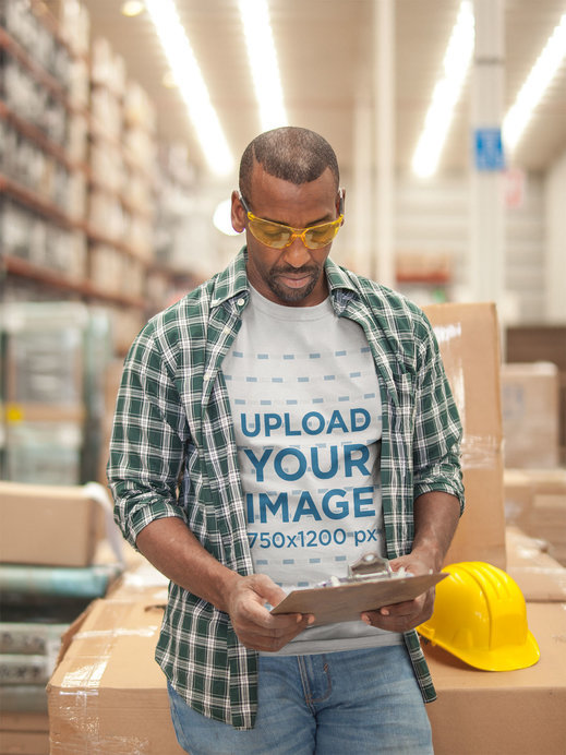 Placeit - Warehouse Worker Wearing a T-Shirt Mockup While Checking the ...