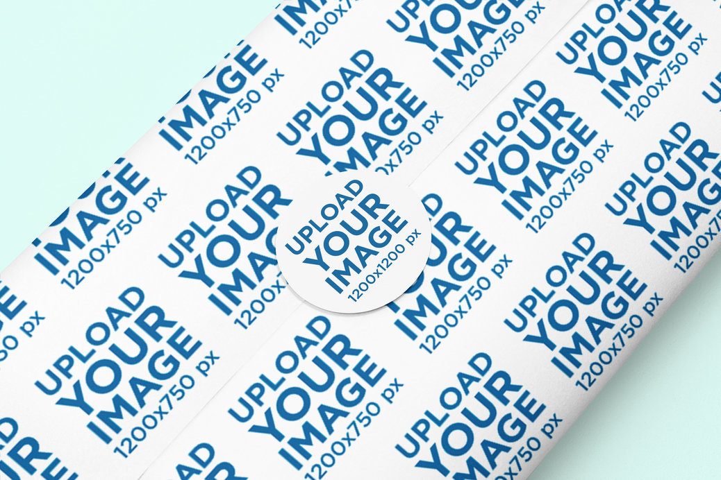 Placeit - Mockup of a Circular Sticker With Wrapping Paper