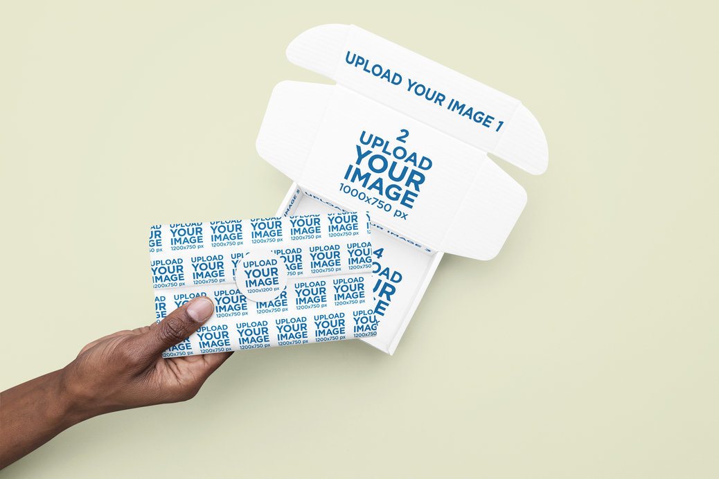 Placeit - Box Mockup Featuring a Person Holding a Piece of Wrapping ...