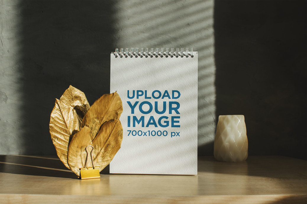 Placeit - Mockup of a Notebook Placed on a Wooden Table Featuring Some ...