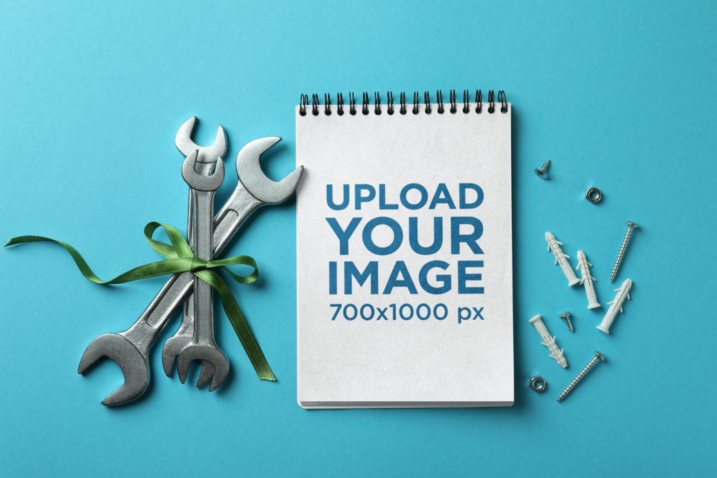 Placeit - Spiral Notebook Mockup Featuring Steel Wrenches and Nails