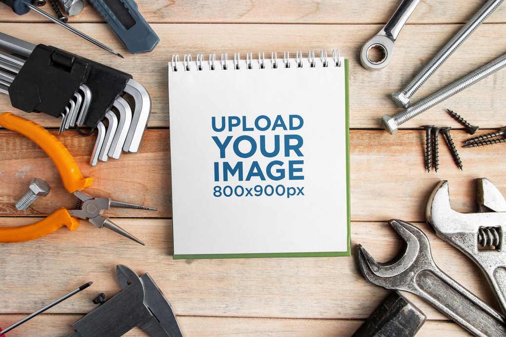 Placeit - Mockup of a Notebook Placed on a Wooden Surface Surrounded by ...