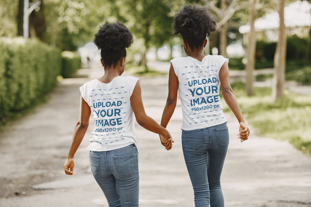 Placeit - Back-View Sleeveless T-Shirt Mockup of Two Sisters Holding Hands