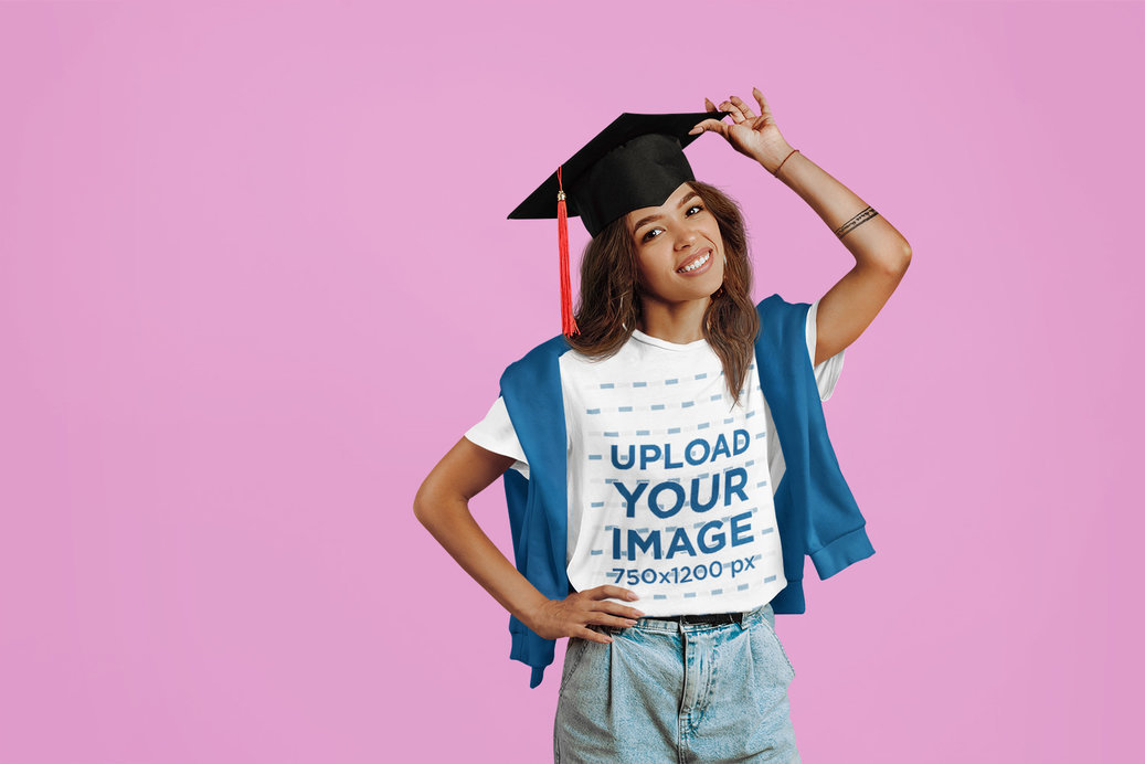 Placeit - T-Shirt Mockup of a Smiling Woman Holding a Graduation Hat