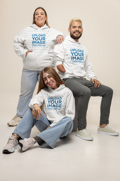 Placeit - Gildan Hoodie Mockup Featuring Three Models Posing Together ...